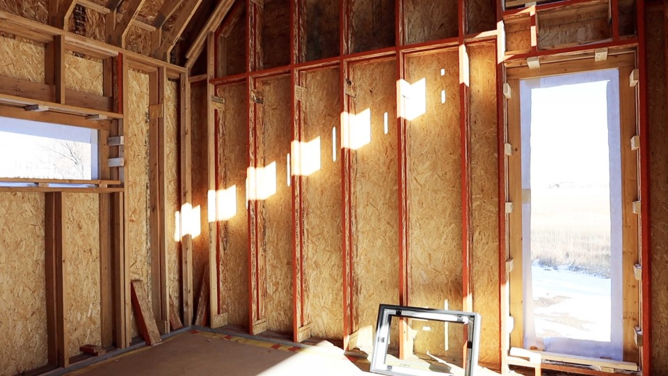 A Passive House with Double Stud Walls and Bark Siding